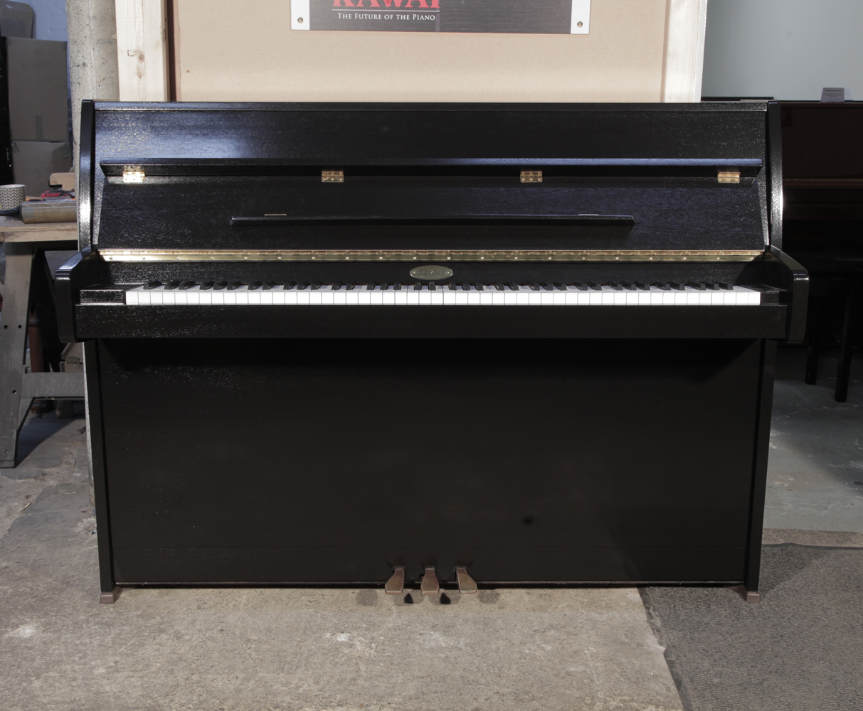 Pre-owned, 1995, Kemble upright piano with a black polished case and ...